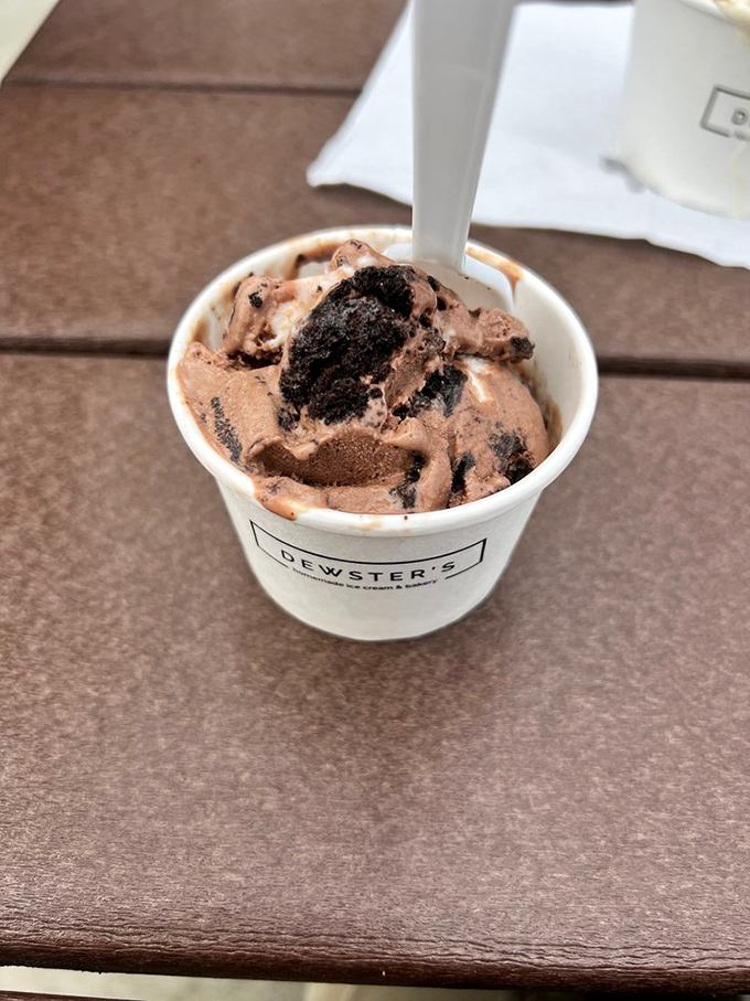 This cookies and cream masterpiece in a freshly made waffle cone isn't just dessert—it's architecture you can eat. Structural integrity never tasted so good.