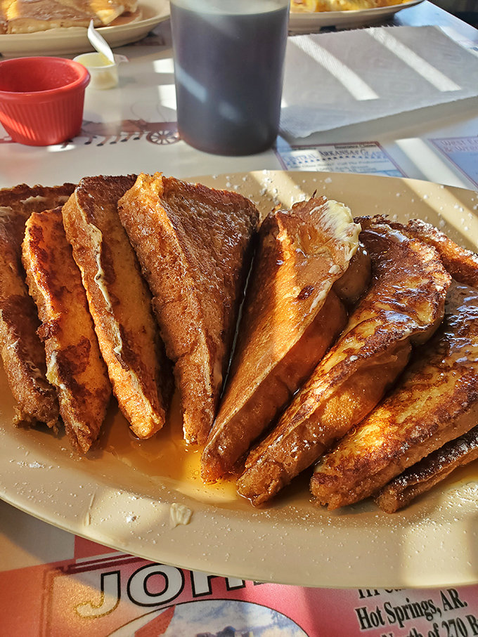 French toast that doesn't just flirt with perfection—it's in a committed relationship. Golden-brown, dusted with powdered sugar, and crowned with a glistening pineapple ring.