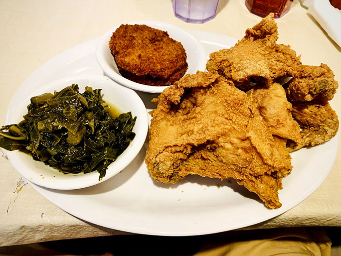 Golden-crusted fried chicken alongside collards swimming in pot likker—a plate that's sparked more Georgia joy than winning the lottery.