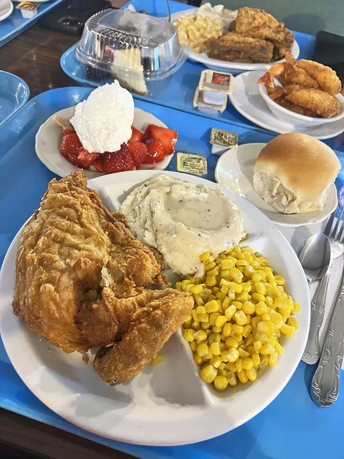Golden-brown fried chicken alongside creamy mashed potatoes and sunny corn—the holy trinity of comfort food. Resistance is both futile and foolish.