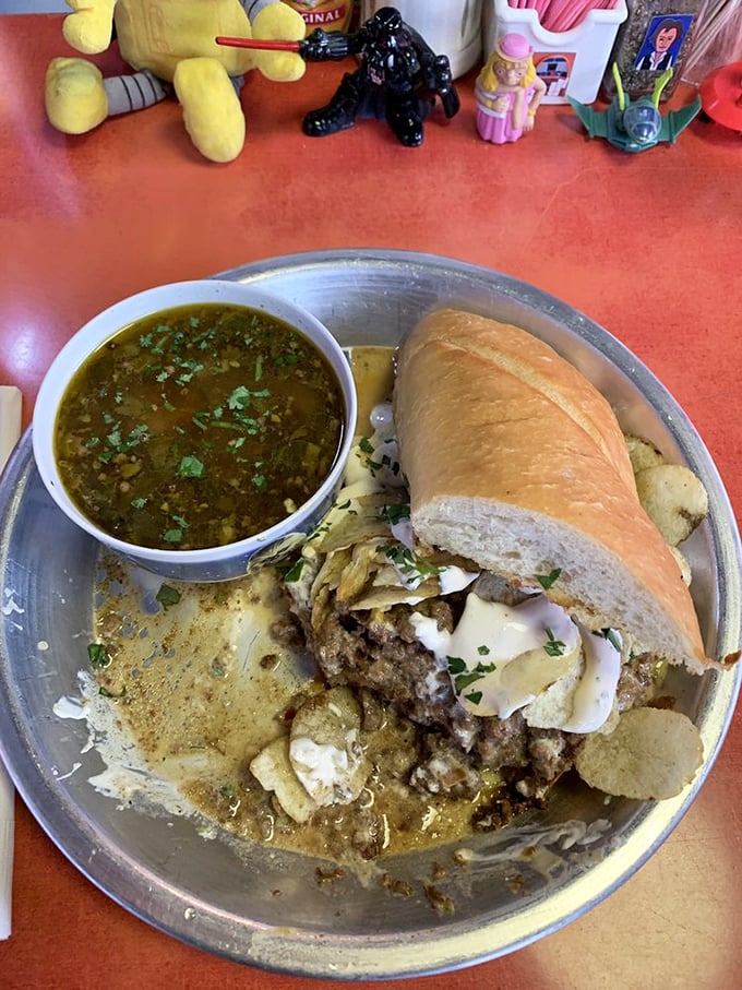 The LT sandwich arrives like a delicious meteorite—loose ground beef, melty cheese, and a side of homemade soup that's clearly made with earthly love.