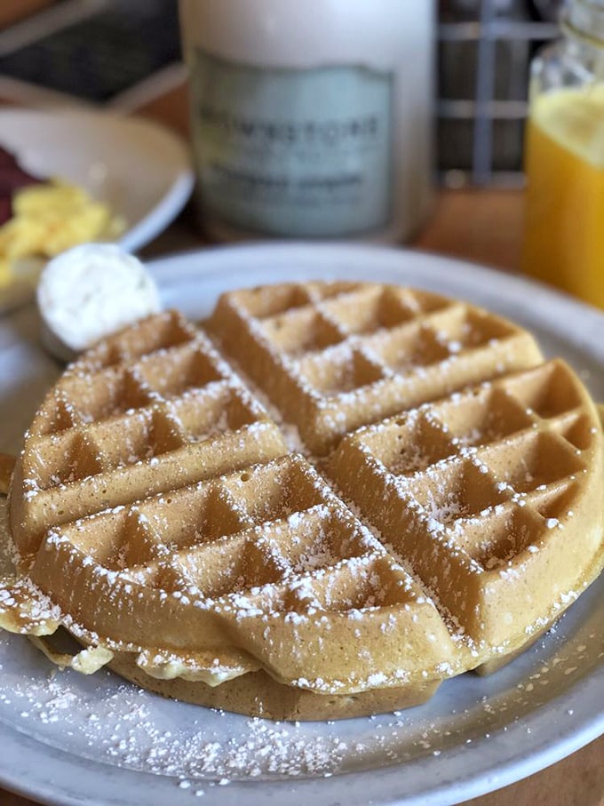 Perfection has a grid pattern. This golden Belgian waffle, dusted with powdered sugar, proves sometimes the classics need no improvement—just pure maple syrup.