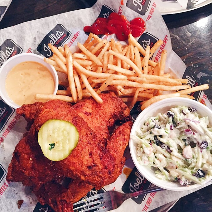 Golden-fried perfection meets pickle precision. This tray isn't just lunch—it's edible architecture where every crispy, juicy bite delivers on that bold red promise outside.