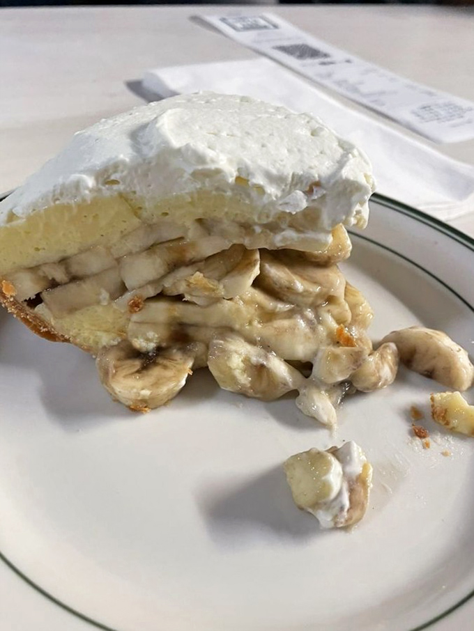 This isn't just banana cream pie – it's edible poetry. Layers of custard, fresh bananas, and whipped cream that would make your grandmother simultaneously proud and jealous.