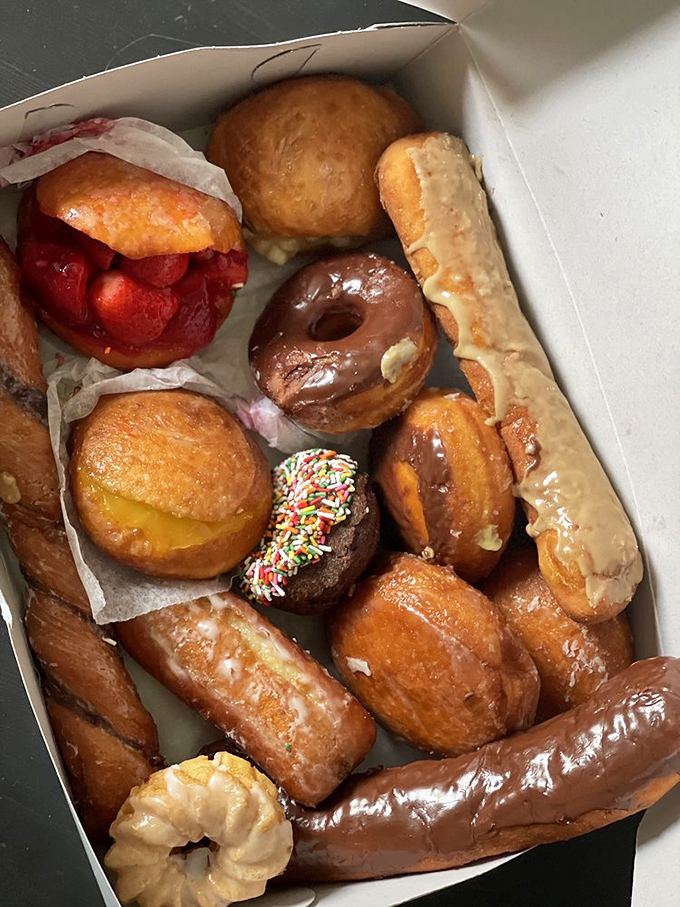 A treasure chest of fried gold—that strawberry-stuffed beauty is the crown jewel in this box of pure California happiness.