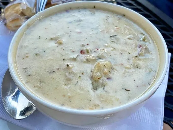 Not all heroes wear capes—some wear creamy broth. This bowl of clam chowder has converted more Manhattan-style devotees than a Patriots winning streak.