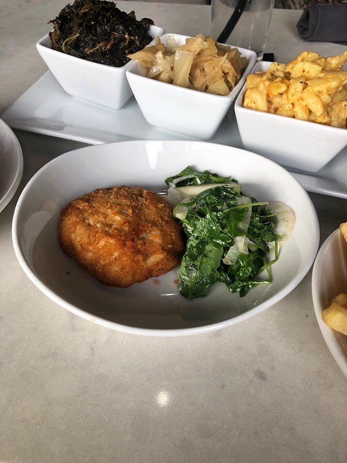 The star of the show—a golden-brown crab cake that's mostly crab and barely enough breading to hold the party together. Maryland would approve.