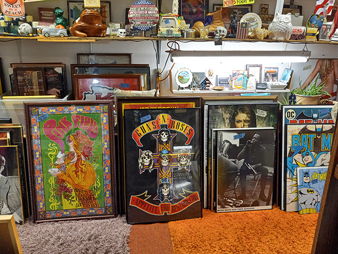 Rock 'n' roll history meets comic book heroes on this wall of framed nostalgia. Guns N' Roses next to Batman—the unexpected friendship we didn't know we needed.