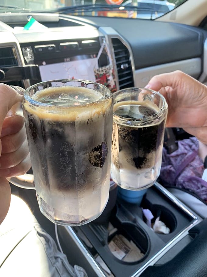 Two frosty mugs of homemade root beer, enjoyed car-side—proof that sometimes the simplest pleasures deliver the most profound joy.