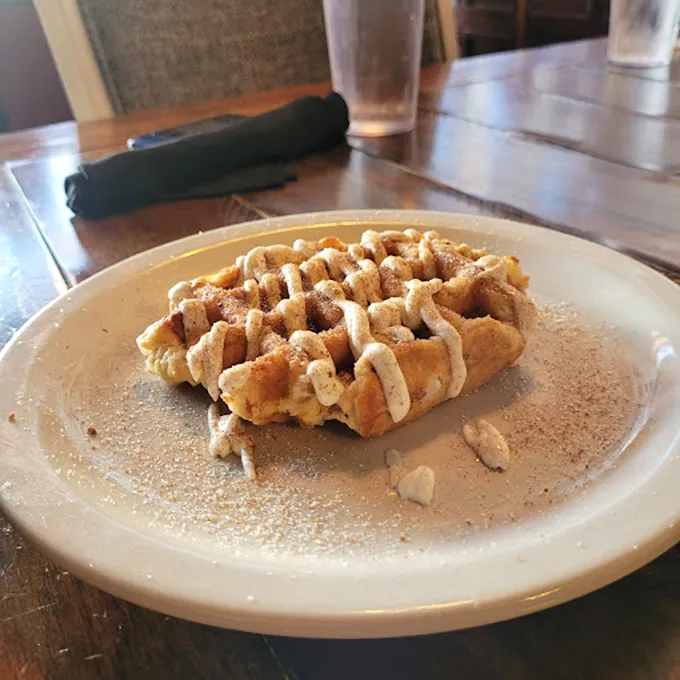 The humble waffle in its purest form—dusted with powdered sugar and ready for its close-up. Simplicity never tasted so complex.