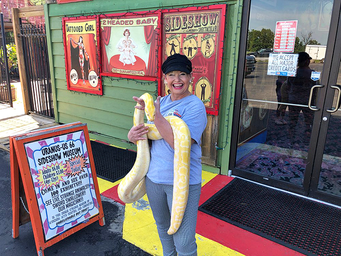 Nothing says "I've been to Uranus" quite like posing with a massive yellow python in front of classic sideshow banners advertising two-headed babies.