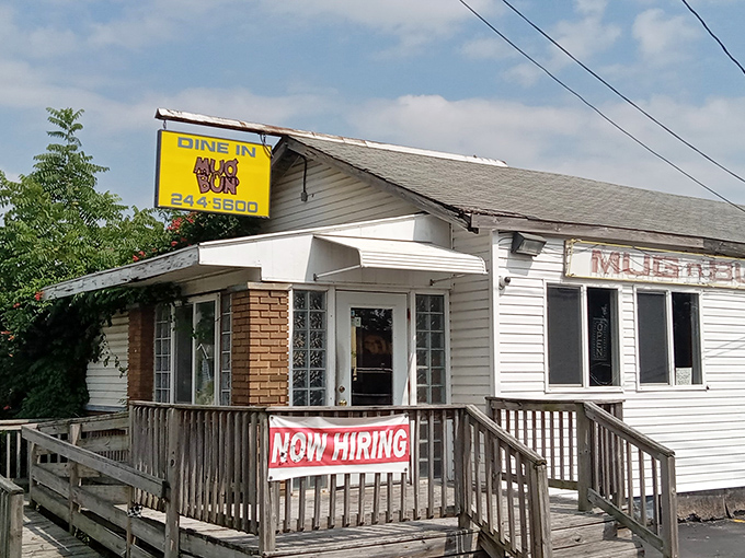 Mug n' Bun's sunny yellow sign promises drive-in nostalgia that tastes even better than your childhood memories.