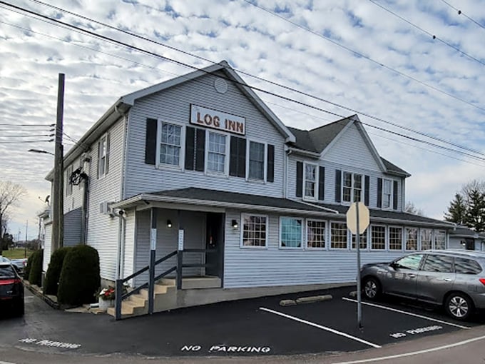 The Log Inn wears its history on its clapboard siding - a humble time machine serving crispy comfort.
