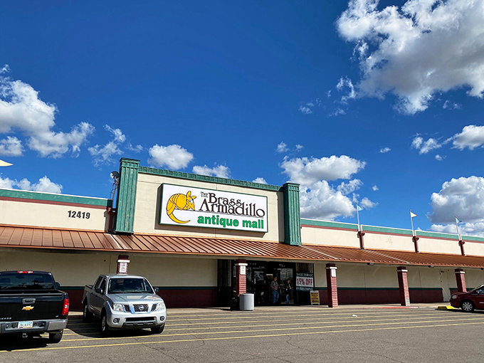 Sunlight bounces off the Brass Armadillo's welcoming façade—a treasure chest disguised as a shopping center. The hunt begins here!