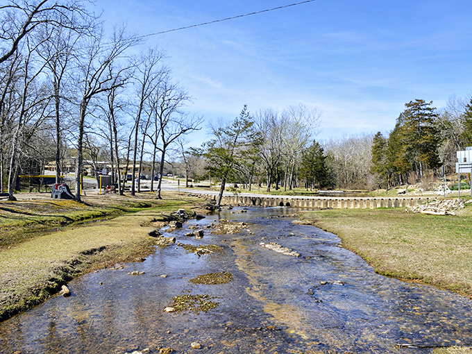 Sunlight dances across Cherokee Village's peaceful lake – retirement paradise without requiring your children's inheritance.