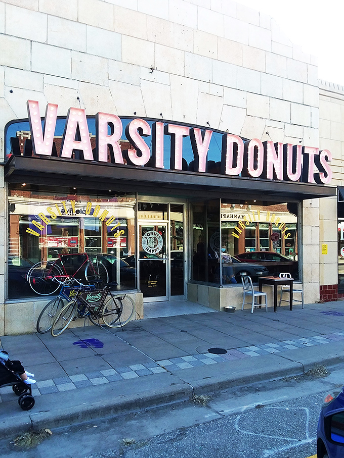 Vintage vibes and bicycle parking outside Varsity Donuts—the Breakfast Club for the cool kids who prefer pastries to detention.