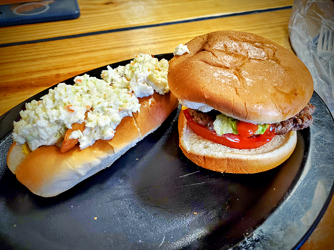 What poetry looks like on a plate: a hand-formed patty meeting its destiny with fresh vegetables on a perfectly toasted bun.