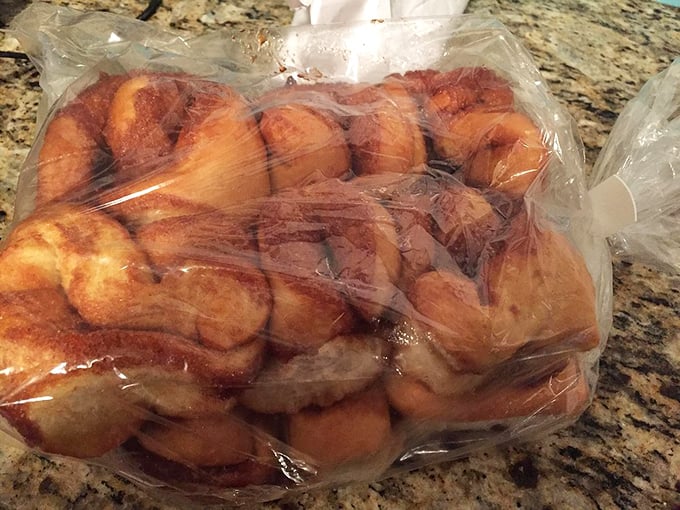 Behold the cinnamon bun motherlode—each one looking like it graduated from pastry school with highest honors, ready to make your morning legendary.