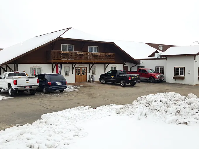 Swiss-inspired architecture covered in snow – because nothing says "authentic cheese experience" like buildings that look like they were imported directly from the Alps. 