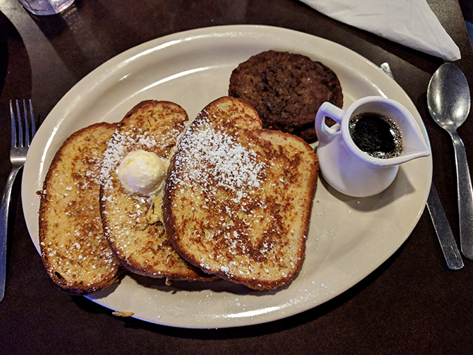 Classic French toast with a pat of butter melting into those golden slices—proof that breakfast simplicity can still be an art form.
