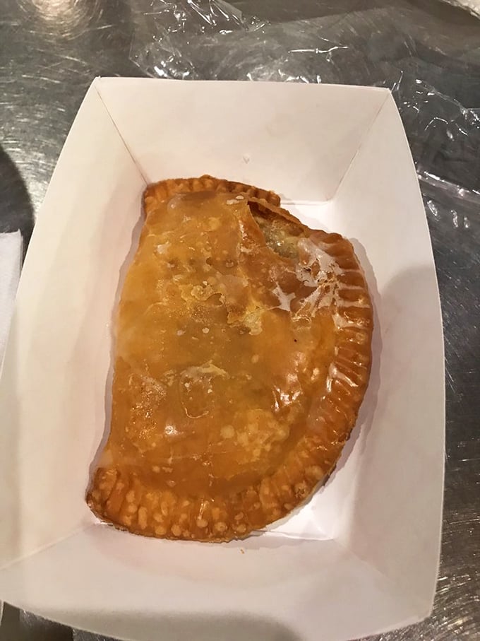 One perfect half-moon of happiness. This golden-crusted fried pie is the reason people drive for hours—flaky, portable, and worth every mile.