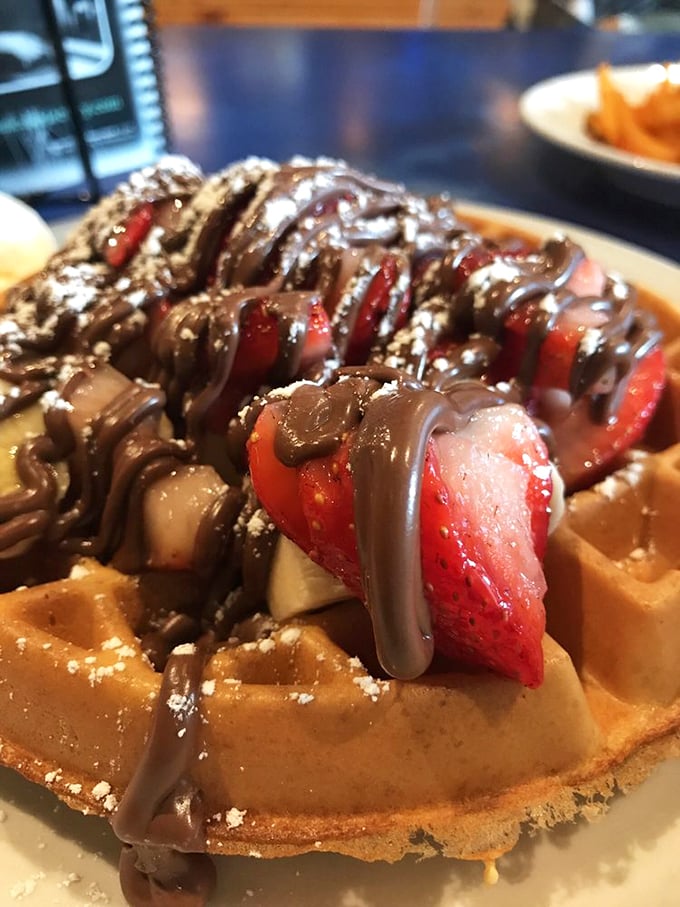 Chocolate-covered strawberries found their true calling atop this waffle. The chocolate drizzle creates edible art that's almost—almost—too beautiful to destroy with a fork.