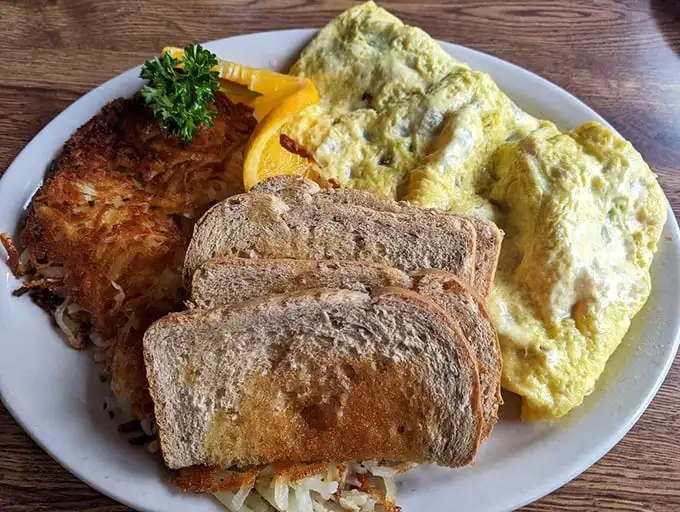 Golden hash browns, perfectly toasted bread, and eggs that would make a chicken proud—breakfast simplicity elevated to an art form.