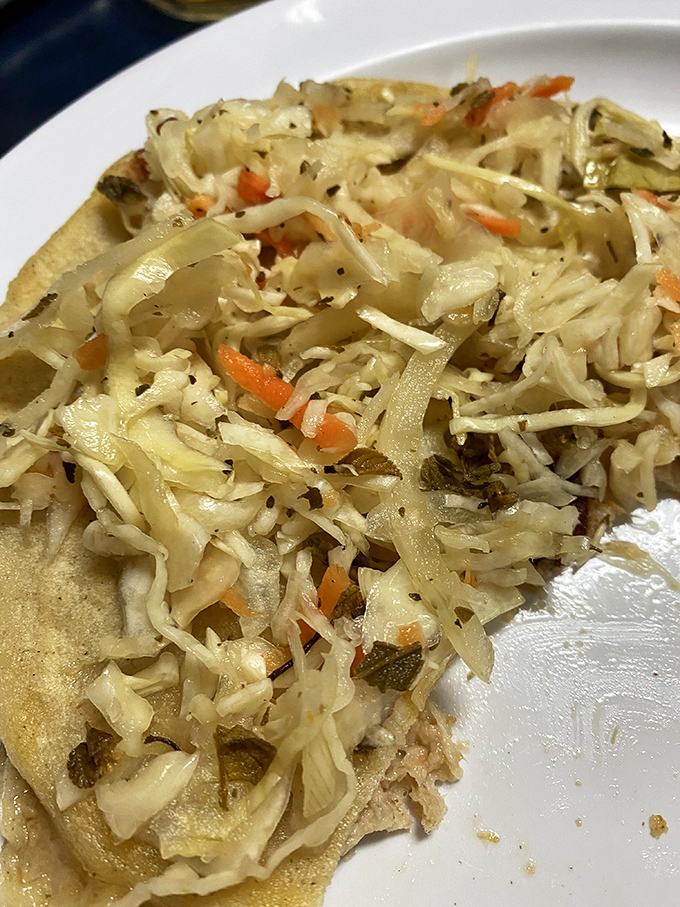 Pupusas with the perfect crisp-to-tender ratio, topped with tangy cabbage slaw. It's the kind of simple perfection that makes you wonder why you'd eat anything else.