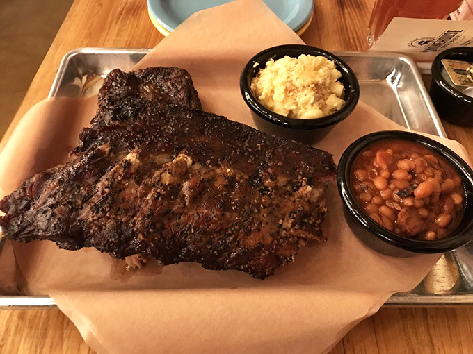 These ribs have the kind of bark that doesn't bite—unless you count the gentle nip of smoke and spice that makes your taste buds stand at attention. 
