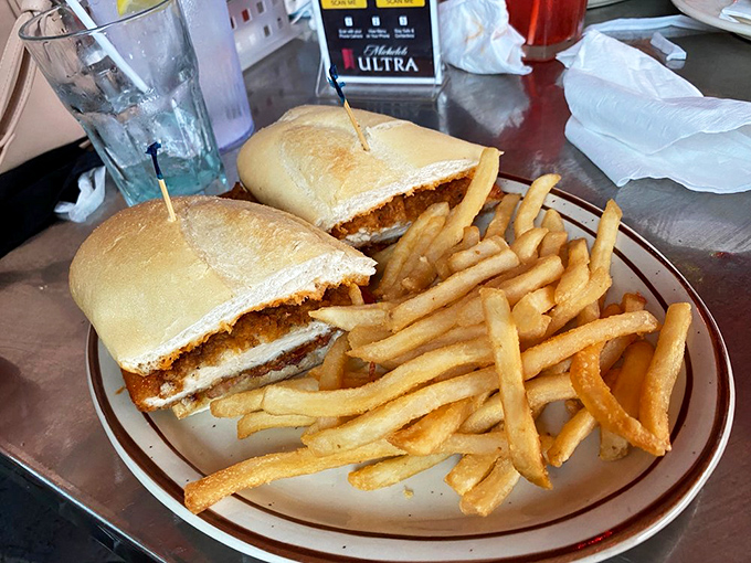 Simplicity done right. This sandwich proves you don't need architectural height to achieve flavor greatness—just quality ingredients and proper execution.