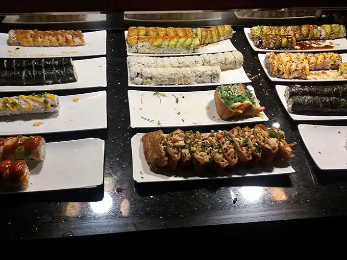 The sushi spread lays before you like edible art—proof that Oklahoma City understands that good things come in rice-wrapped packages.