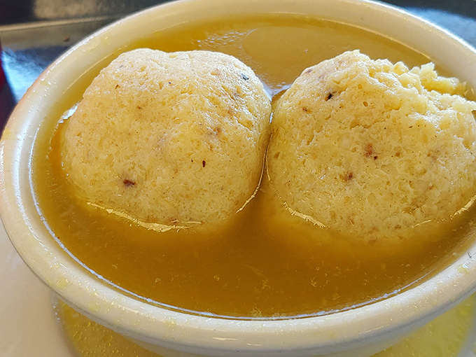 Twin planets of comfort orbiting in a broth universe. These matzo balls aren't just food—they're edible therapy.