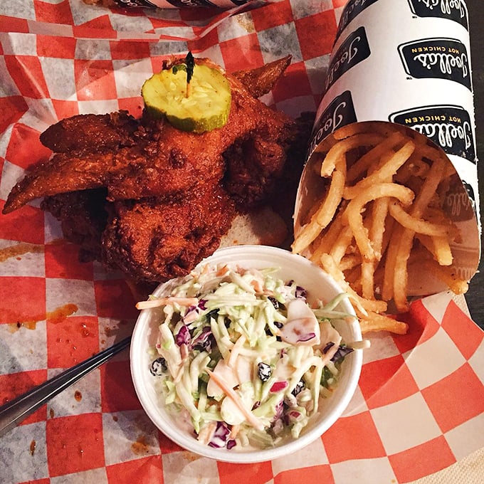 The holy trinity of Southern comfort: spice-kissed chicken, crispy fries, and creamy slaw. This isn't just a meal—it's a masterclass in textural harmony.