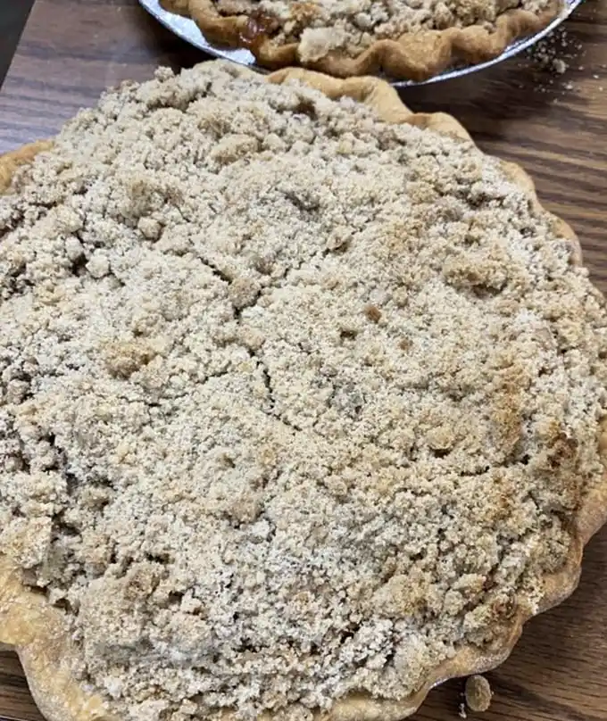 That crumble topping isn't just a pie covering – it's a buttery, brown sugar invitation to experience what your grandmother was talking about all those years.