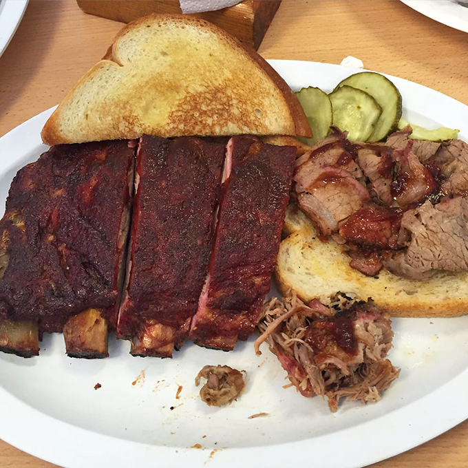 The barbecue equivalent of a greatest hits album: ribs with a smoke ring that would make Saturn jealous, alongside brisket that practically dissolves on contact.