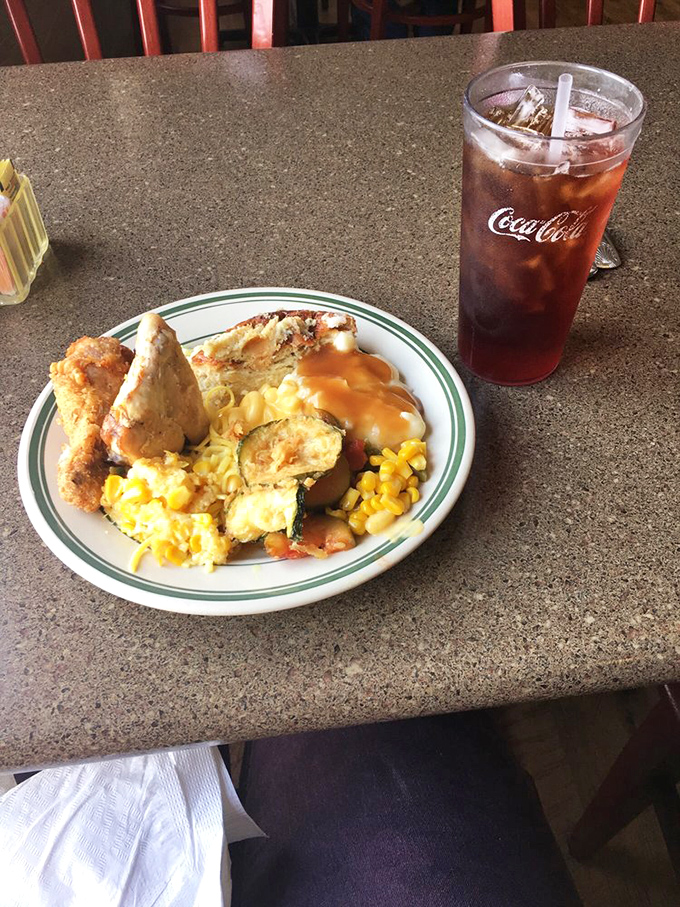 The perfect Midwest buffet plate—where fried chicken, creamy potatoes, and sweet corn create a holy trinity of comfort food bliss.