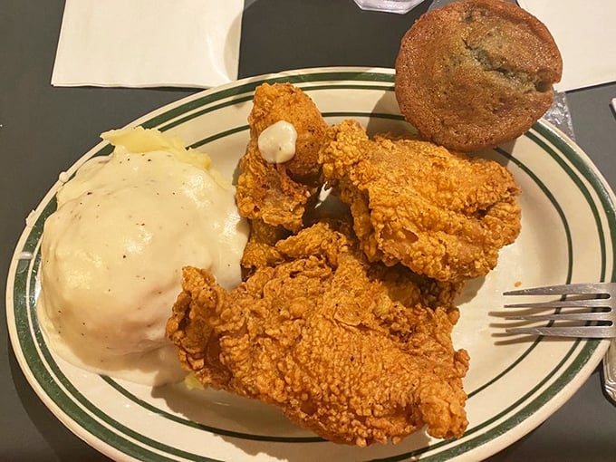 Fried chicken so perfectly golden it deserves its own Instagram account—paired with mashed potatoes that could make a grown man weep with joy.