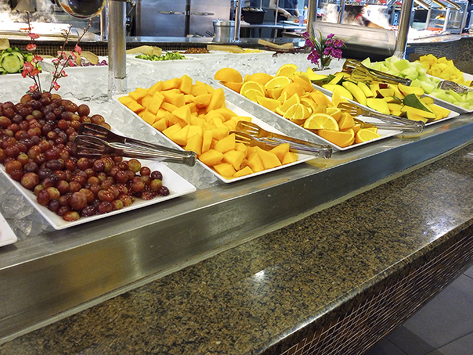 The fresh fruit station: where you pretend to be health-conscious after your third plate of crab legs. That pineapple isn't just garnish—it's strategic stomach real estate.
