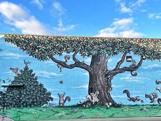 Even the exterior walls tell a sweet story – playful squirrels frolic around a nut tree in this whimsical mural.