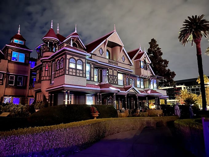 At night, the mansion transforms from merely mysterious to magnificently eerie, its illuminated windows glowing like portals to another dimension.
