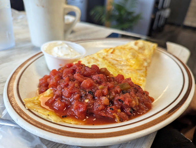 An omelet smothered in salsa that doesn't just wake up your taste buds—it gives them a standing ovation and encore performance.
