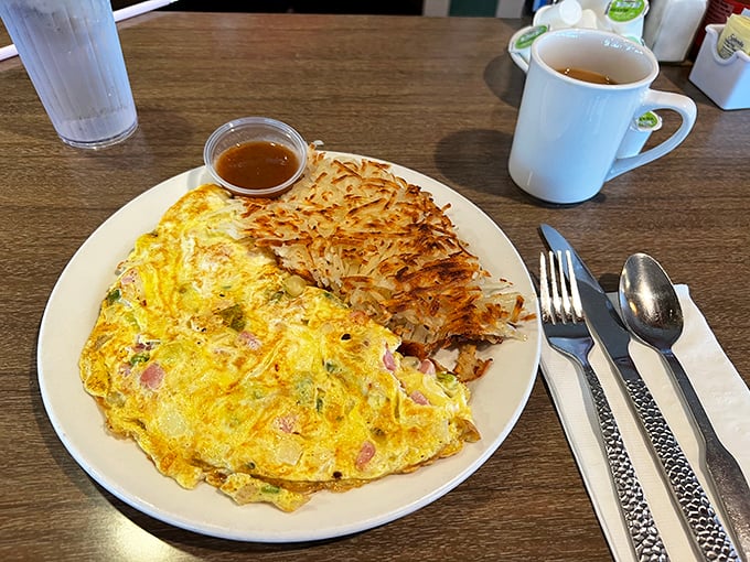 An omelet that doesn't need to name-drop fancy ingredients to impress you, paired with hash browns that achieve that perfect crisp-to-fluffy ratio.