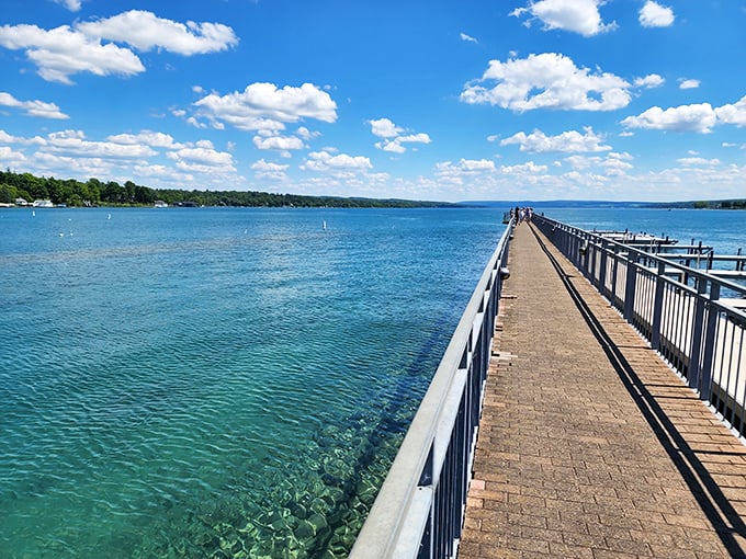 The village pier extends like an invitation into crystal-clear waters, a perfect post-meal stroll destination for working off that extra slice of pie.