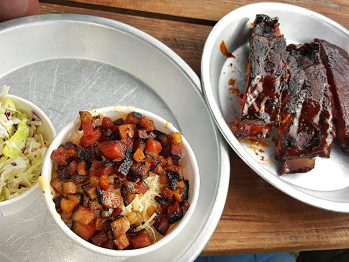 These sides aren't playing supporting roles—they're co-stars. The beans have chunks of meat that would be the headliner at lesser establishments.