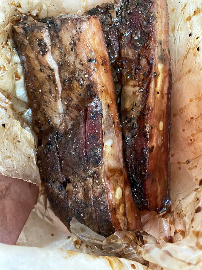 The close-up that launched a thousand road trips. That pepper-crusted exterior is like meat jewelry—beautiful to look at, better to devour.