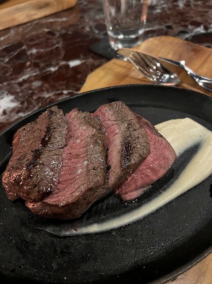 Behold the sirloin—sliced to showcase that perfect pink center, it's the steak equivalent of catching a Florida sunset at just the right moment.
