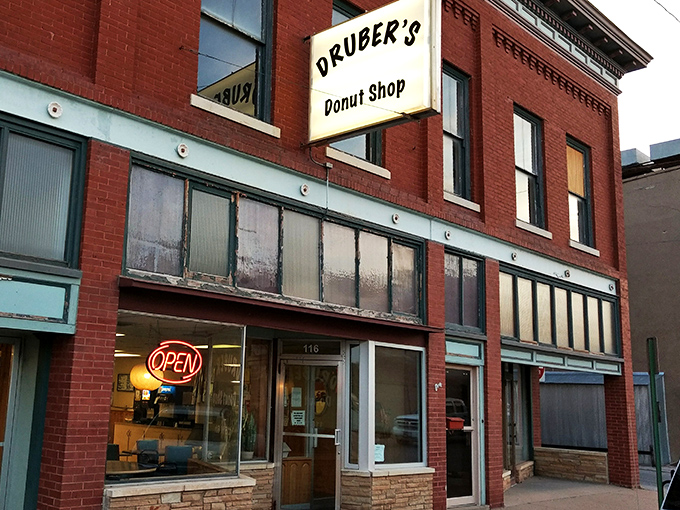 Druber's vintage sign hanging from classic red brick—like finding your grandma's secret recipe box in a modern kitchen. Timeless!