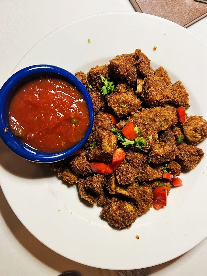 The dish that launched a thousand dares. These crispy nuggets of Western tradition have converted more skeptics than a revival meeting.