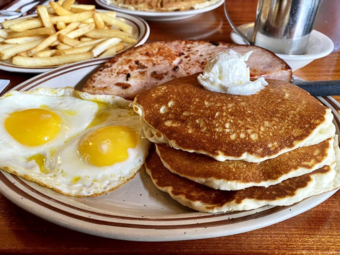 That's not just an omelette—it's an architectural marvel of eggs, cheese, and fillings that puts most fancy brunch spots to shame. 