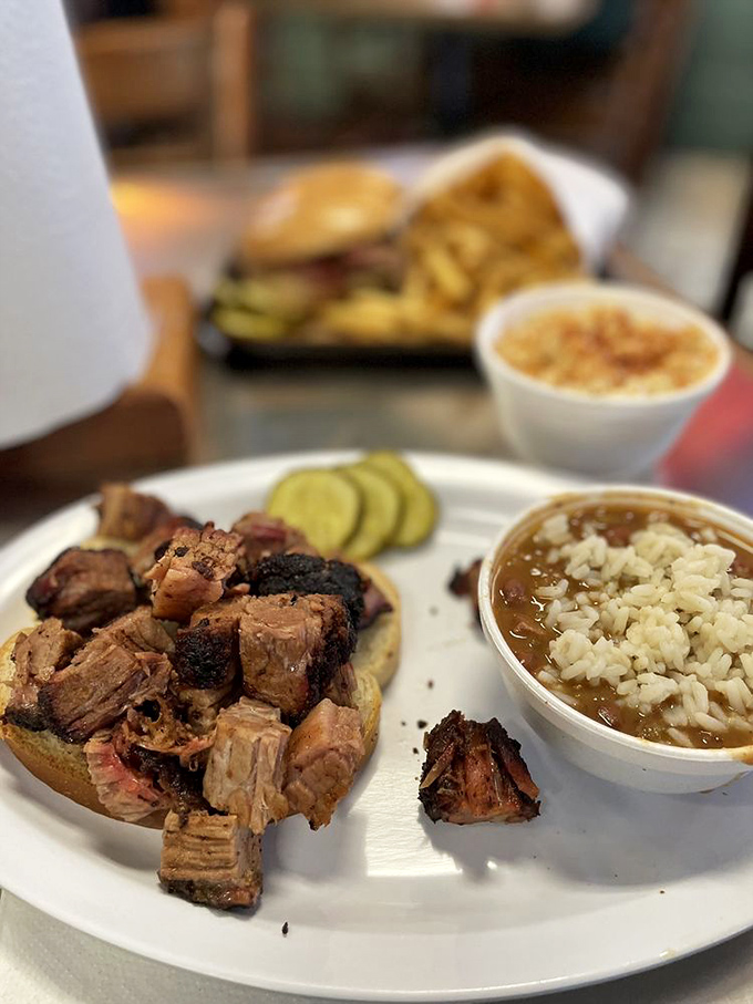 Burnt ends—those caramelized cubes of brisket heaven—served alongside beans that have clearly been taking flavor lessons from their meaty neighbors.
